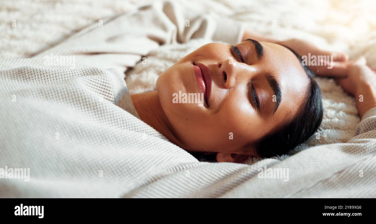 Woman, fatigue and sleeping on bed for relax, comfortable and afternoon ...
