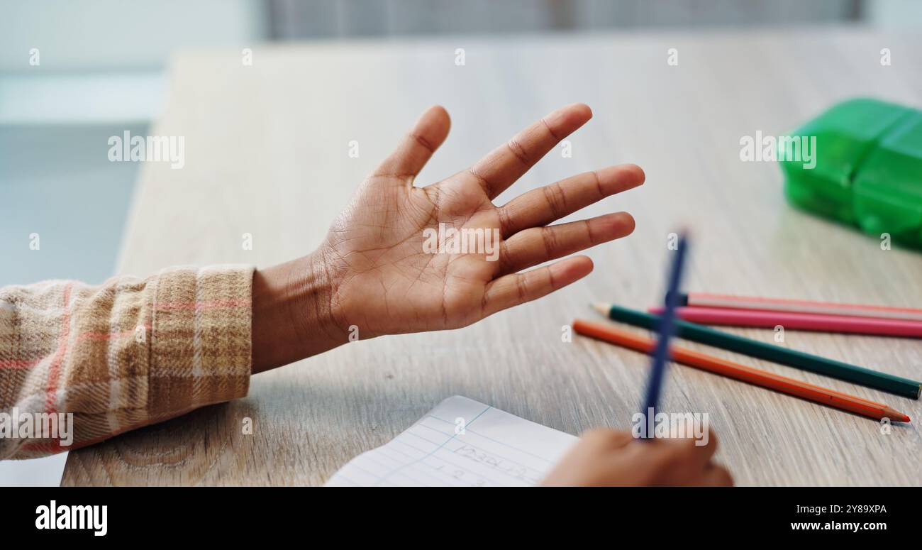 Hands, education and child in classroom, counting and writing of ...