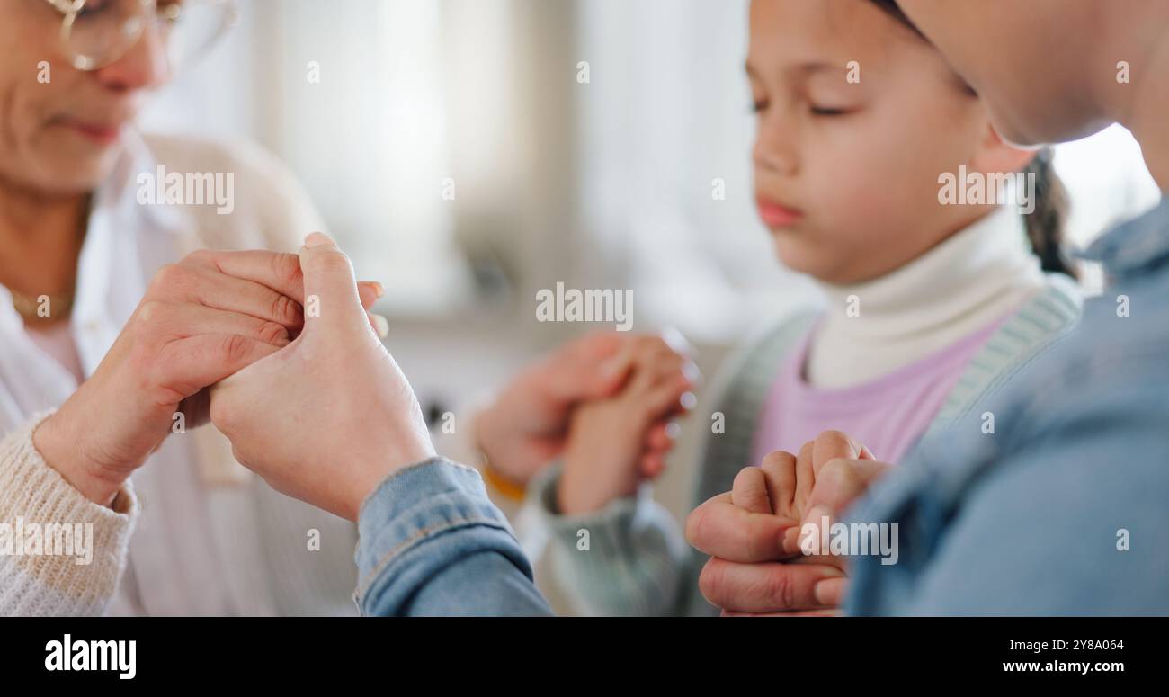 Praying, holding hands and family in home for religion, healing and ...