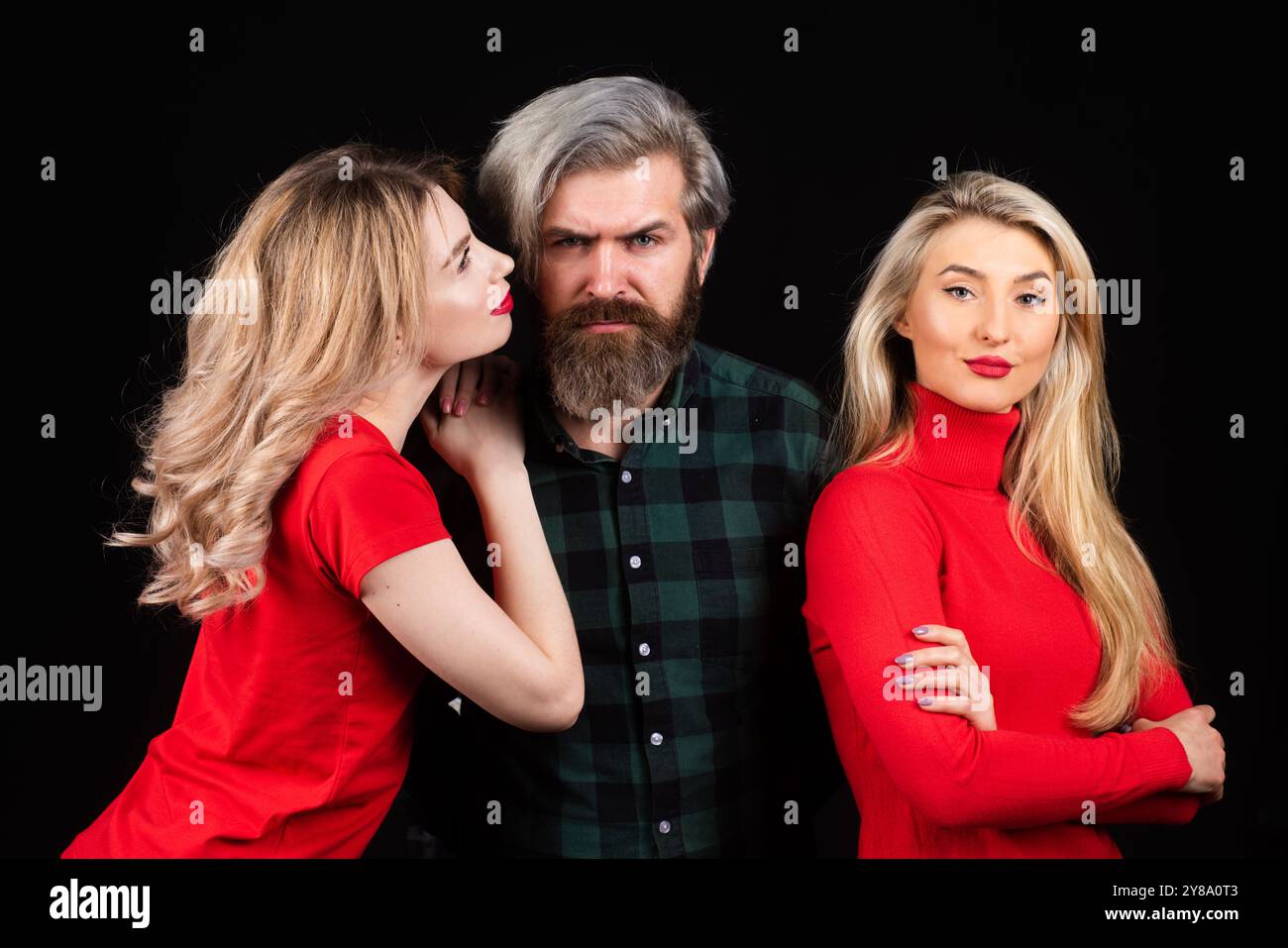 Group of fashion models posing in studio. Group of tree People. Friends ...