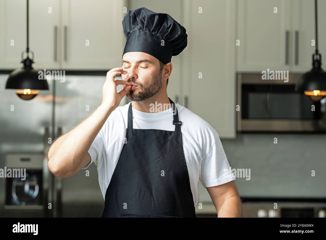 Portrait of chef cooker in kitchen. Chef with sign of perfect food ...