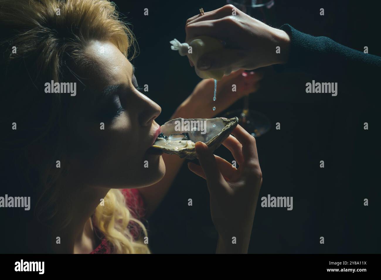 Oysters shell close up. Woman eat oyster. Oyster dinner in restaurant ...