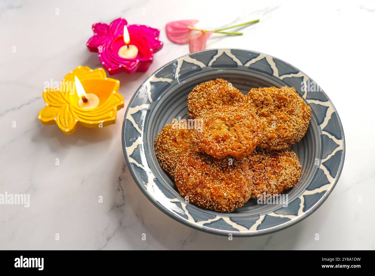 Anarsa is a popular Indian sweet made from rice, sugar, ghee, and poppy ...