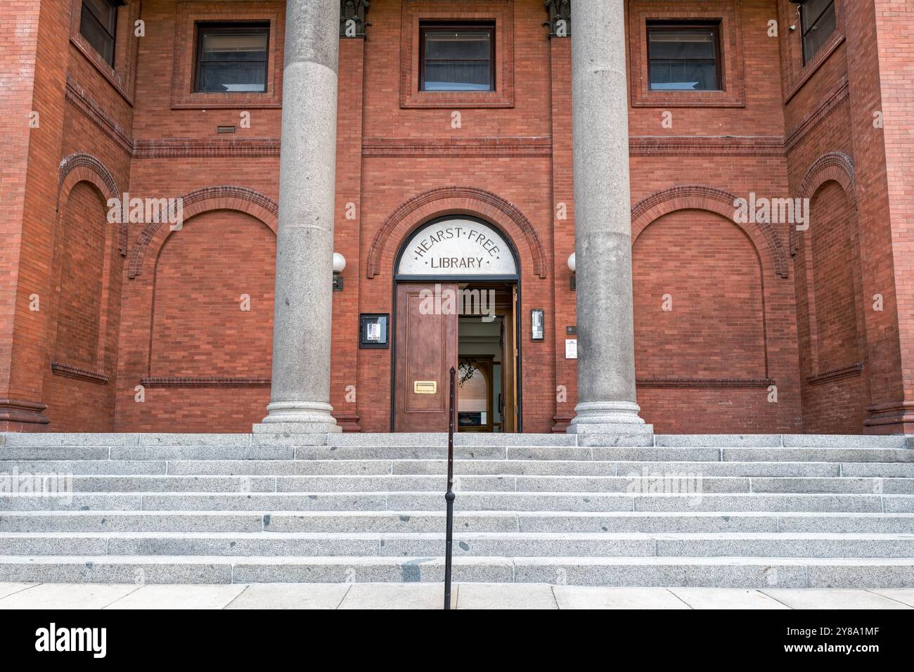 Steps lead to the entrance of the historic Hearst Free Library in ...