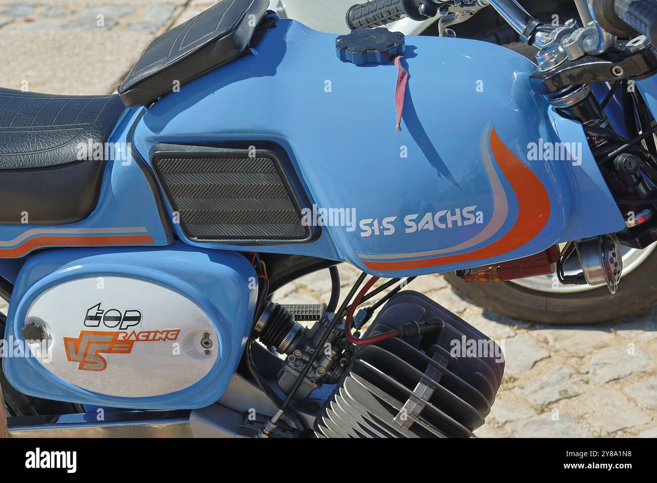 Detail of a blue motorcycle sis sachs v5 top racing parked on ...