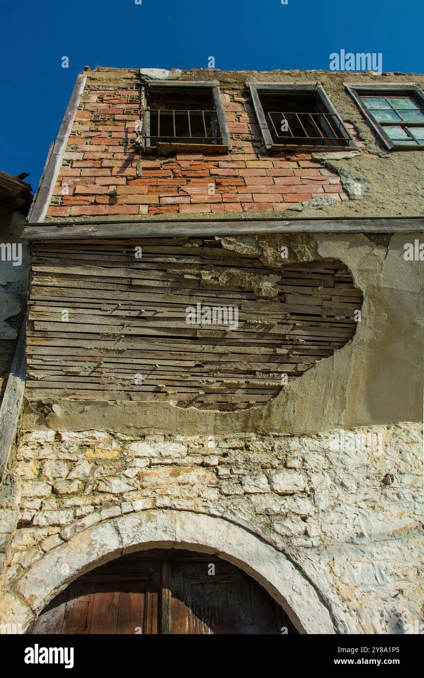 An historic house with half-timbered jettying overhanging a lane in the ...