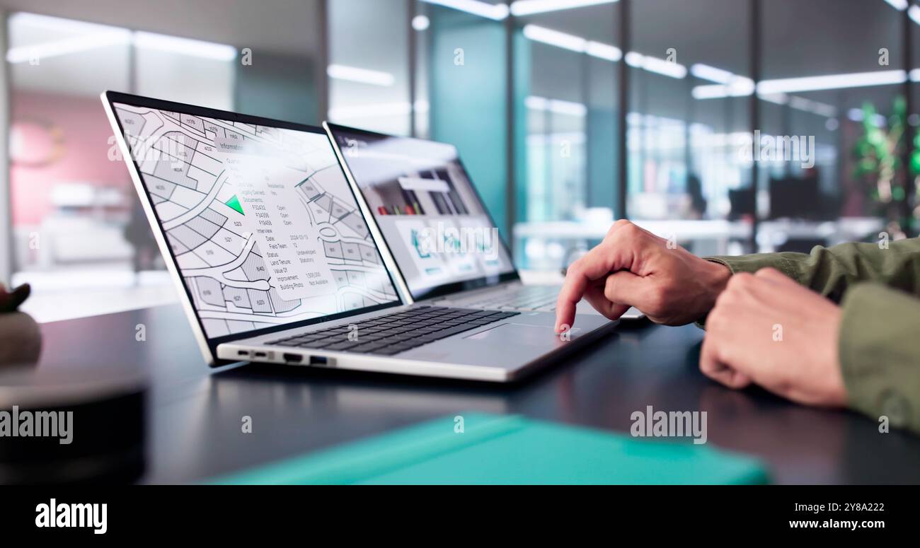Developer Looking At Land Plot Map And Cadastre Plan Stock Photo - Alamy