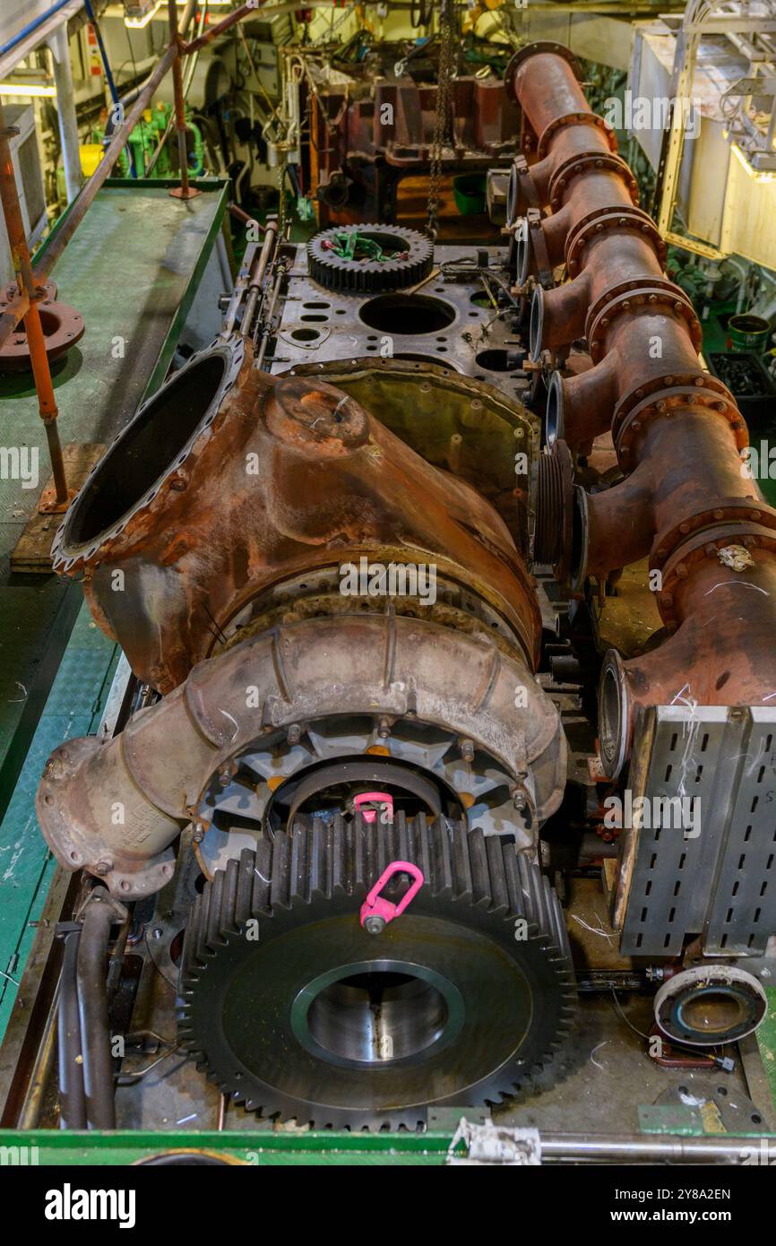 Main engine repairing. Inside engine room on big ship. Marine engine on ...
