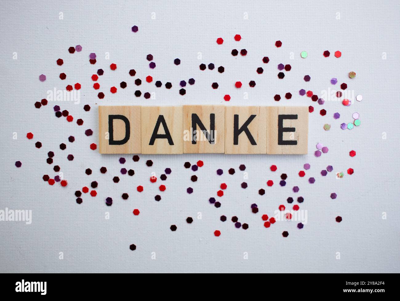 Thank you card with german language DANKE on wooden block on background ...