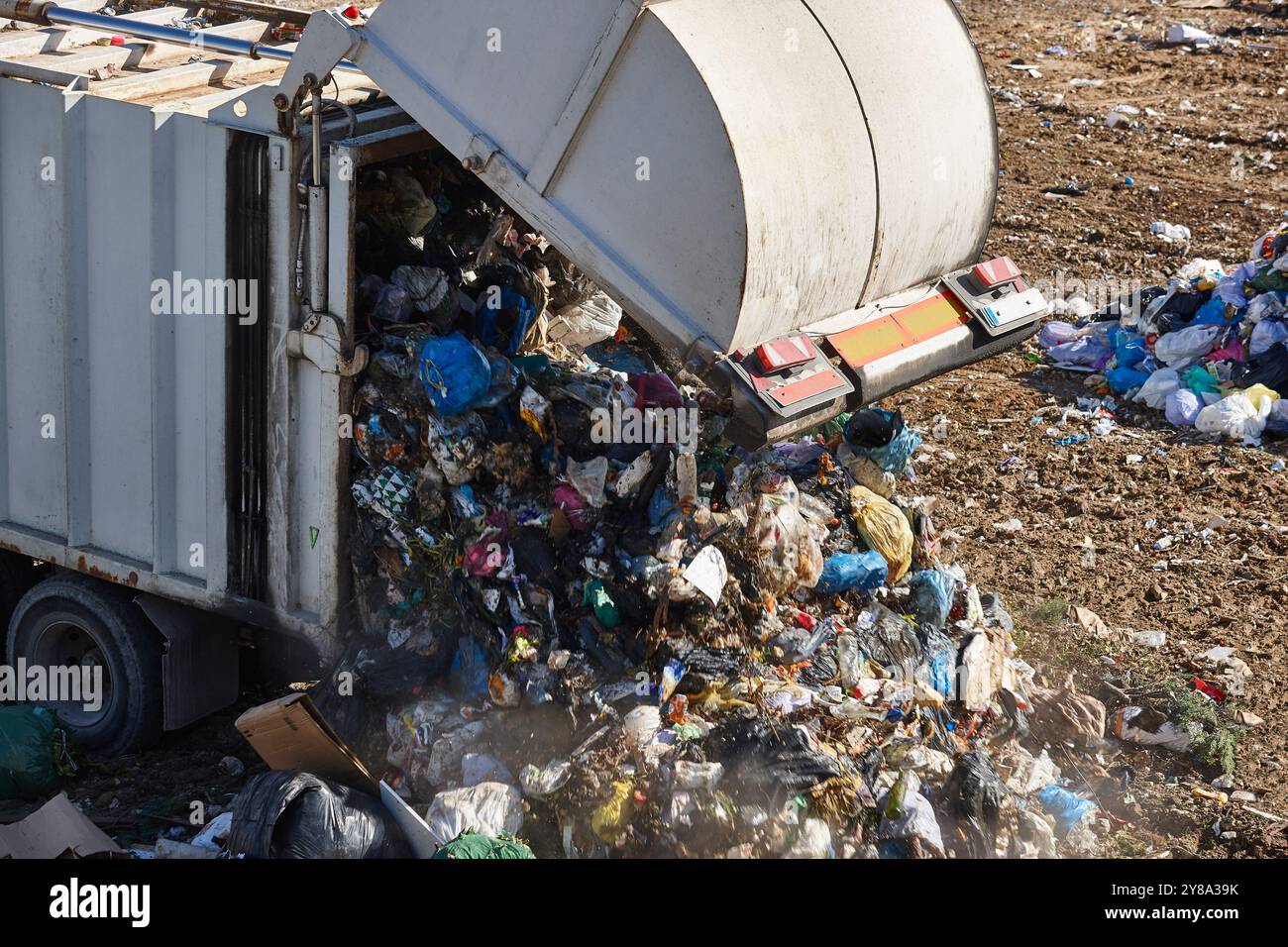 Truck unloading garbage on an open air dump. Waste recycling Stock ...
