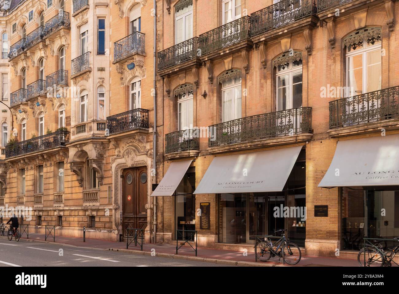 typical street view of the French balconies in downtown Toulouse with ...
