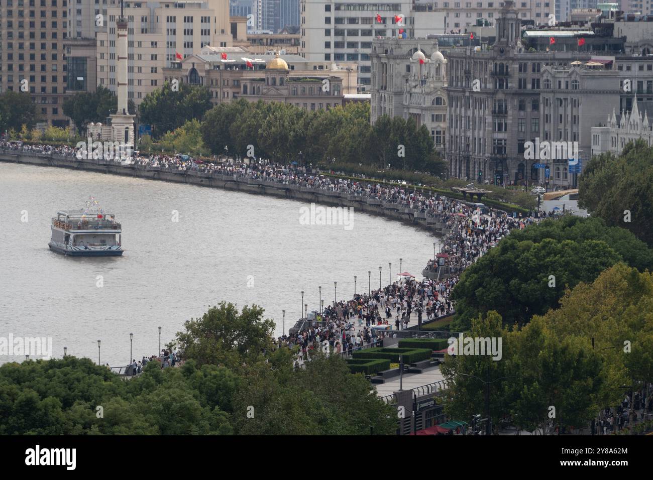 SHANGHAI, CHINA - OCTOBER 4, 2024 - Tourists visit the Bund in Shanghai ...