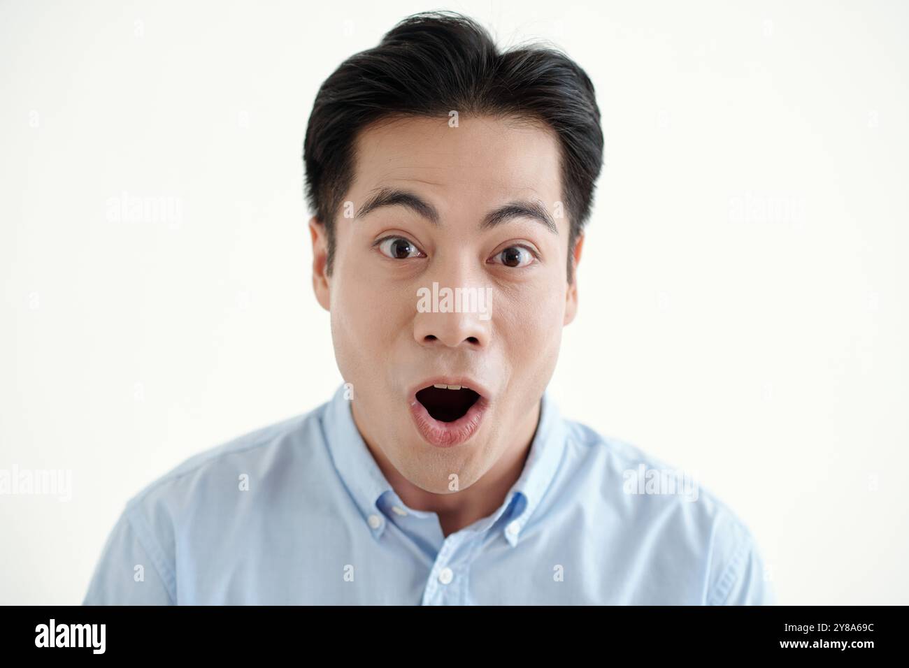 Surprised man looking camera in hi-res stock photography and images - Alamy
