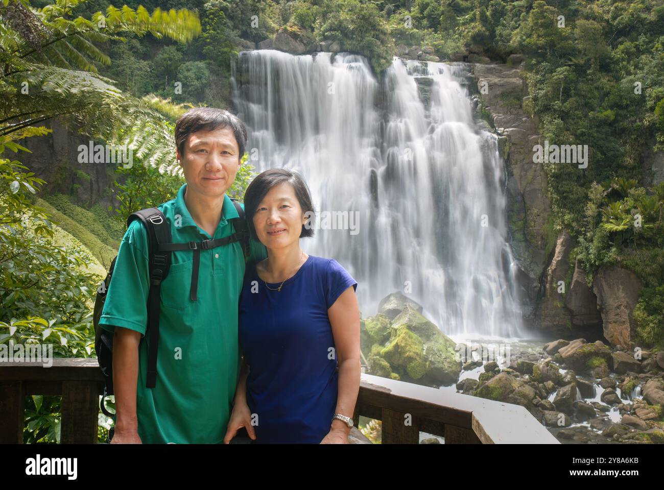 Couple posing for photos in front of Marokopa Falls. Waikato. New ...