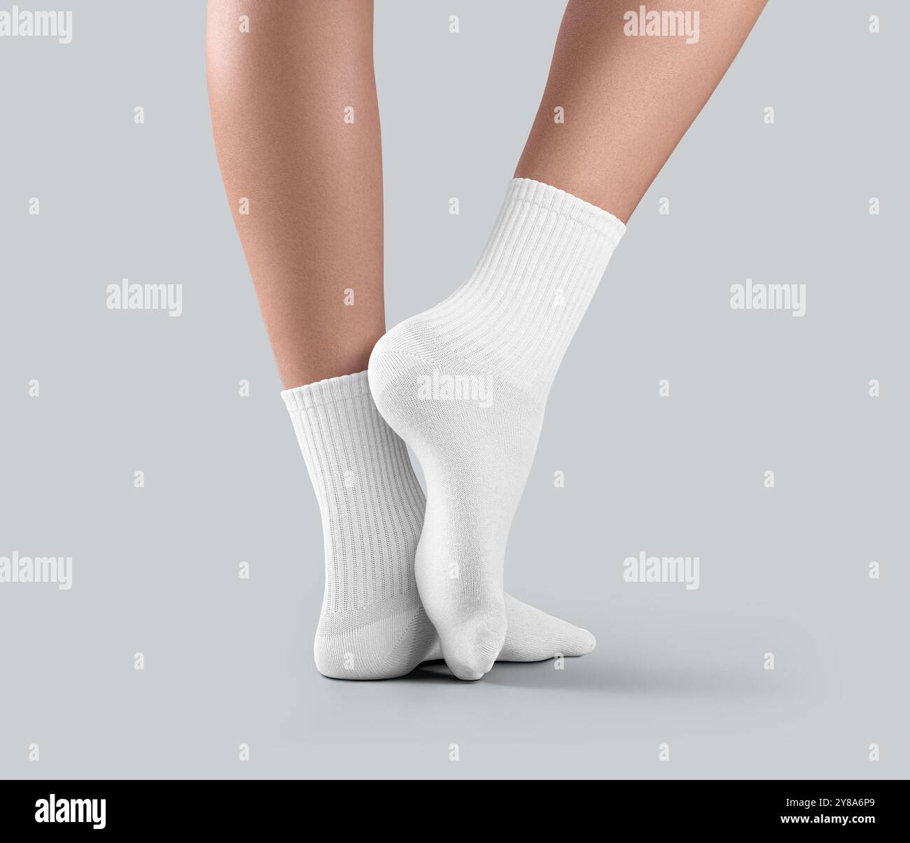 Mockup of white medium socks on women's feet, stretched toes, isolated ...