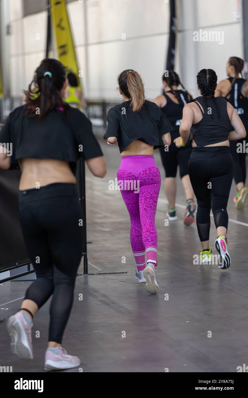Indoor Marathon - Girls running Together Stock Photo - Alamy