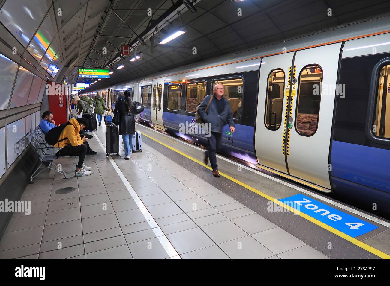London, Heathrow airport. An Elizabeth Line train arrives at Heathrow ...