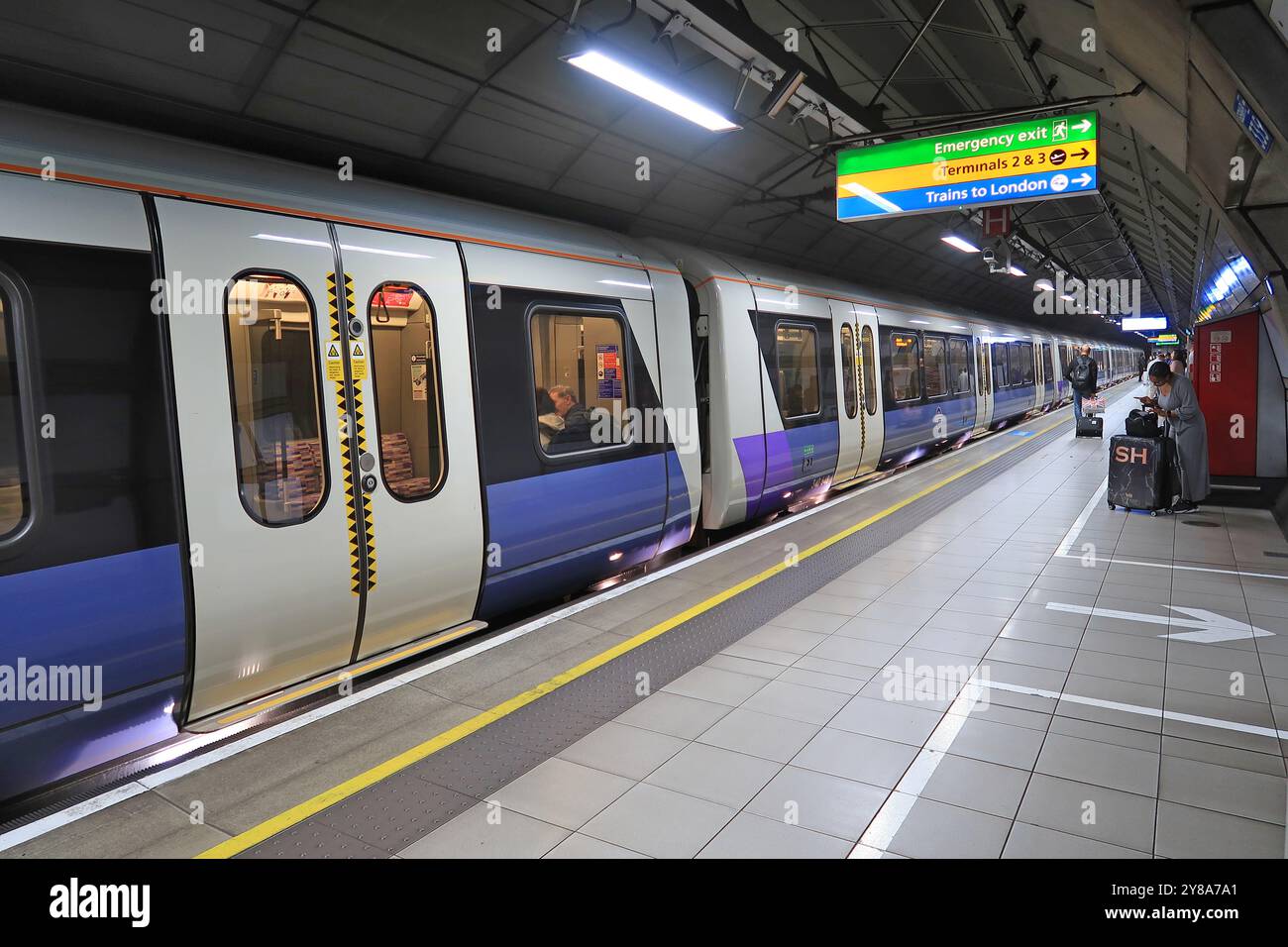 London, Heathrow airport. An Elizabeth Line train arrives at Heathrow ...