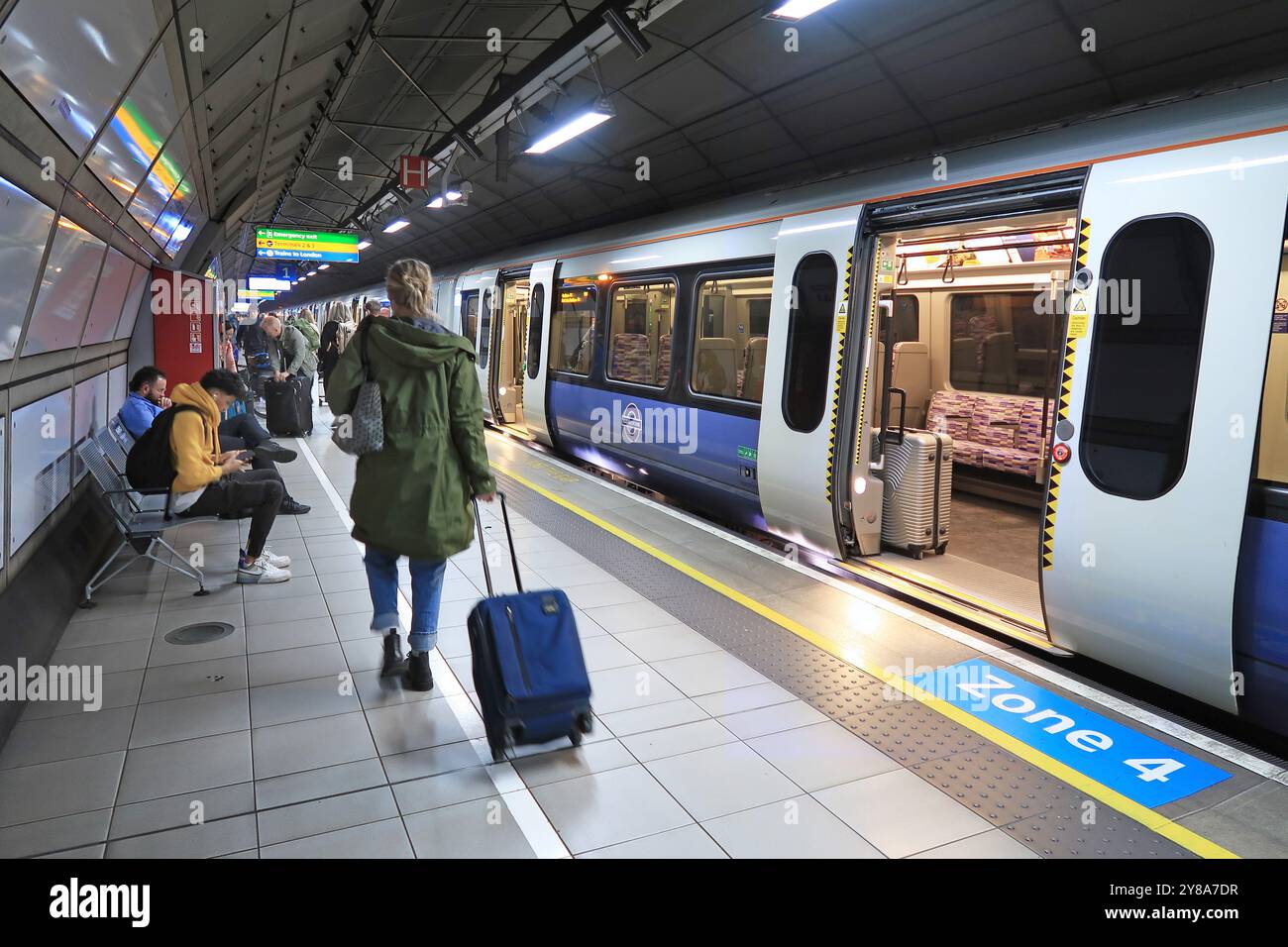London, Heathrow airport. An Elizabeth Line train arrives at the ...