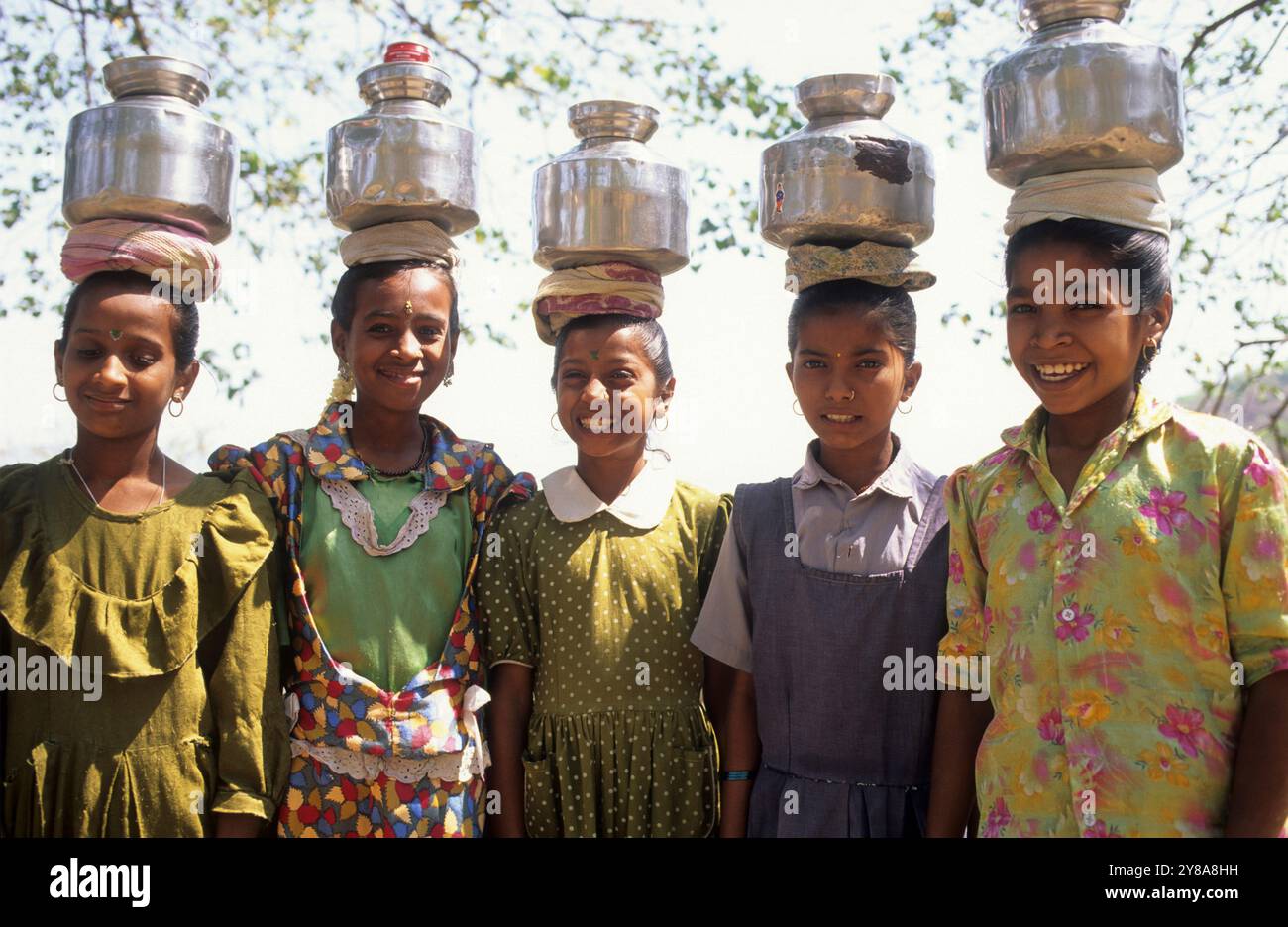 India, Mumbai, Girls with water jugs Stock Photo - Alamy