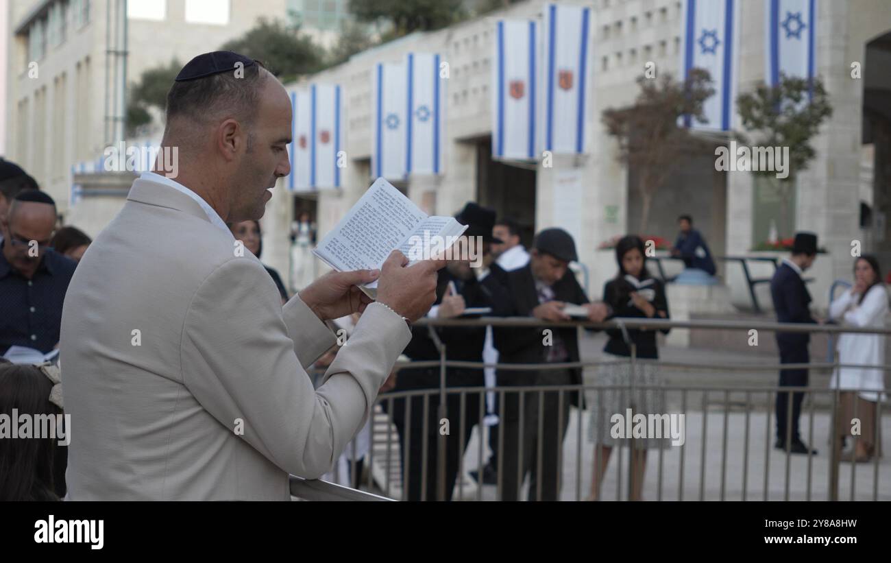 JERUSALEM - OCTOBER 3: Religious Jews pray around a small pool during ...