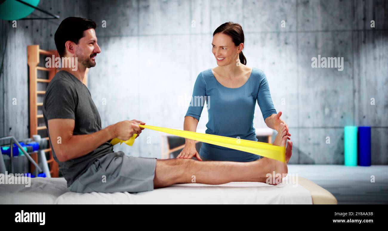 Knee Exercise Therapy And Treatment Using Physical Band Stock Photo - Alamy