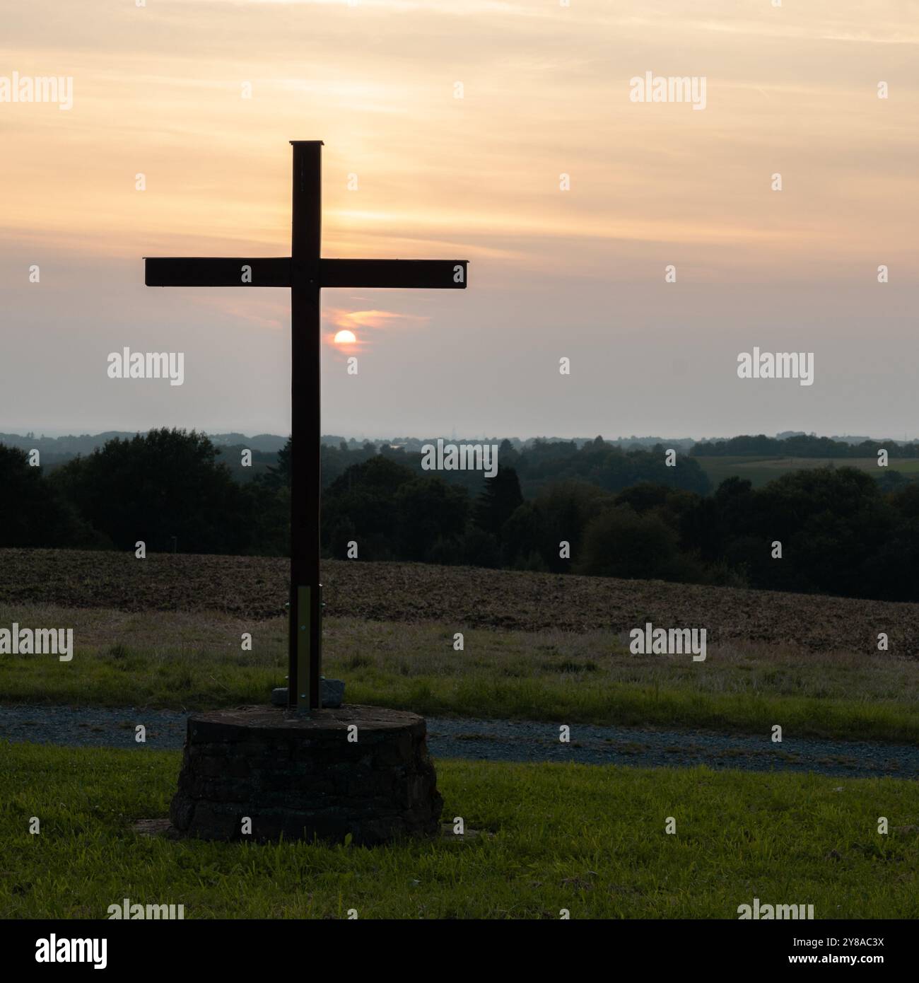 Wooden cross standing among trees hi-res stock photography and images ...