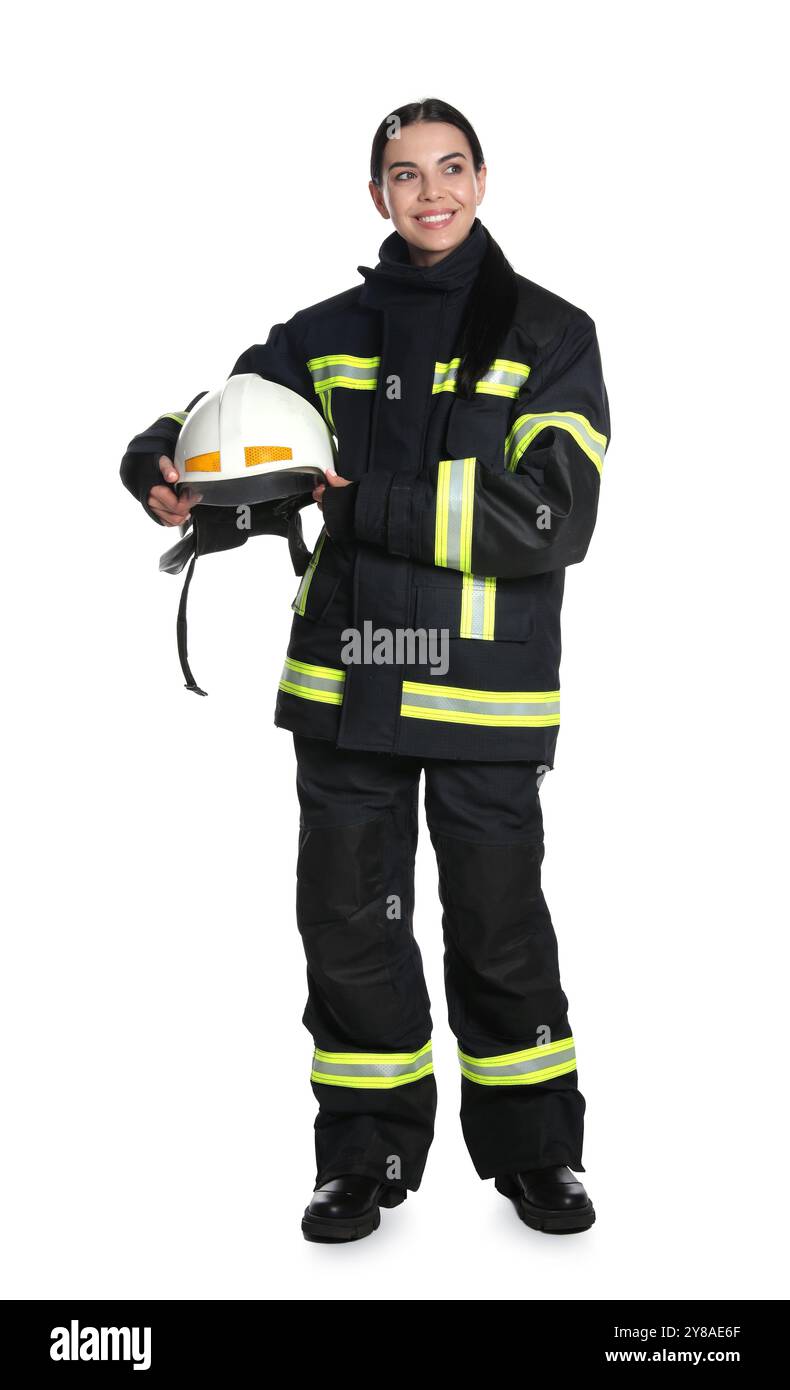Full length portrait of firefighter in uniform with helmet on white ...