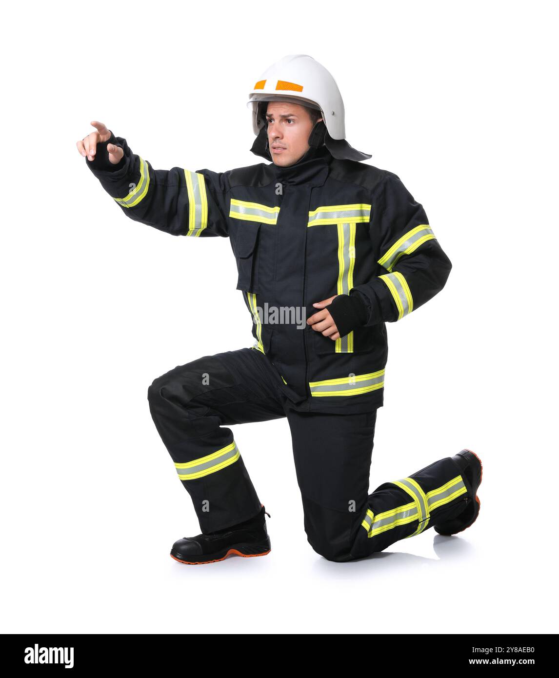 Full length portrait of firefighter in uniform and helmet on white ...