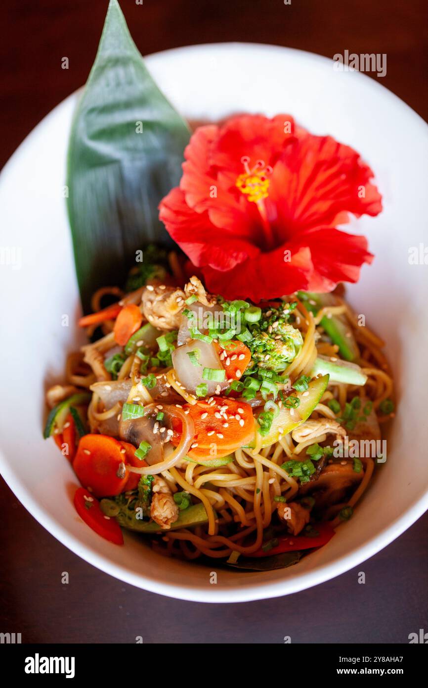 Overhead view of noodle salad with flower Stock Photo - Alamy