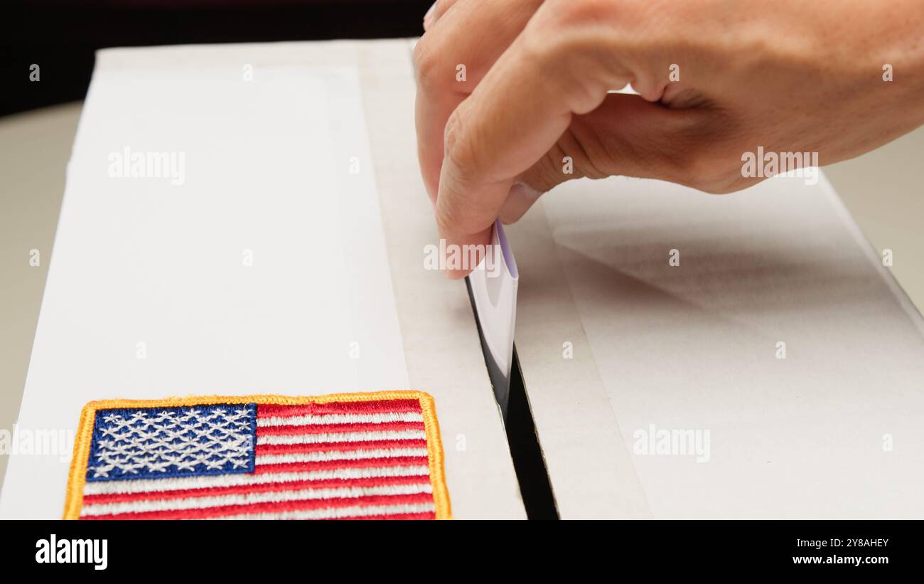 Inserting ballot in box for US presidential election Stock Photo - Alamy
