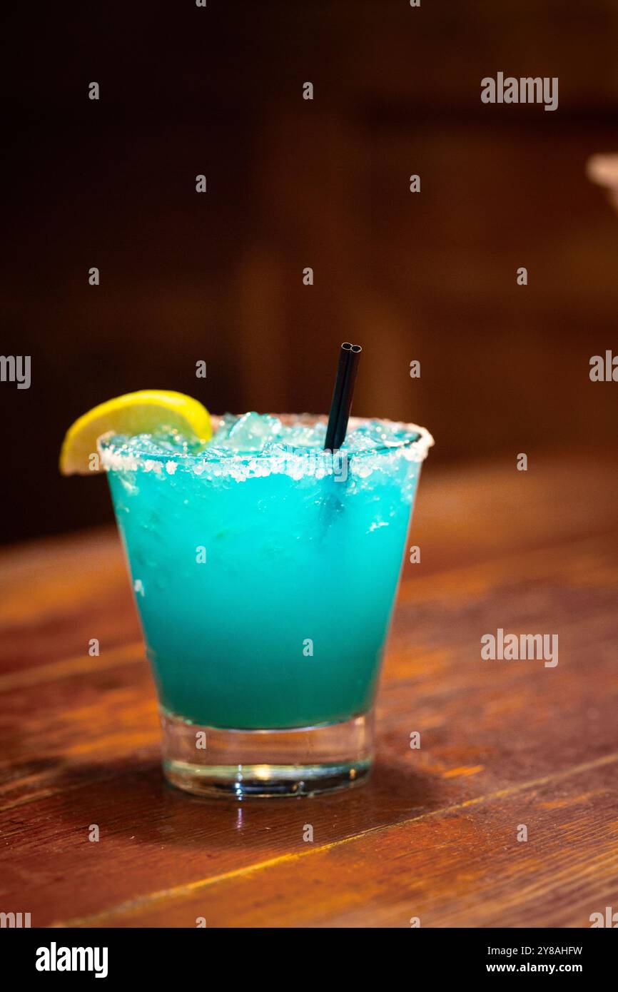 A vibrant blue cocktail with salted rim vertical Stock Photo - Alamy