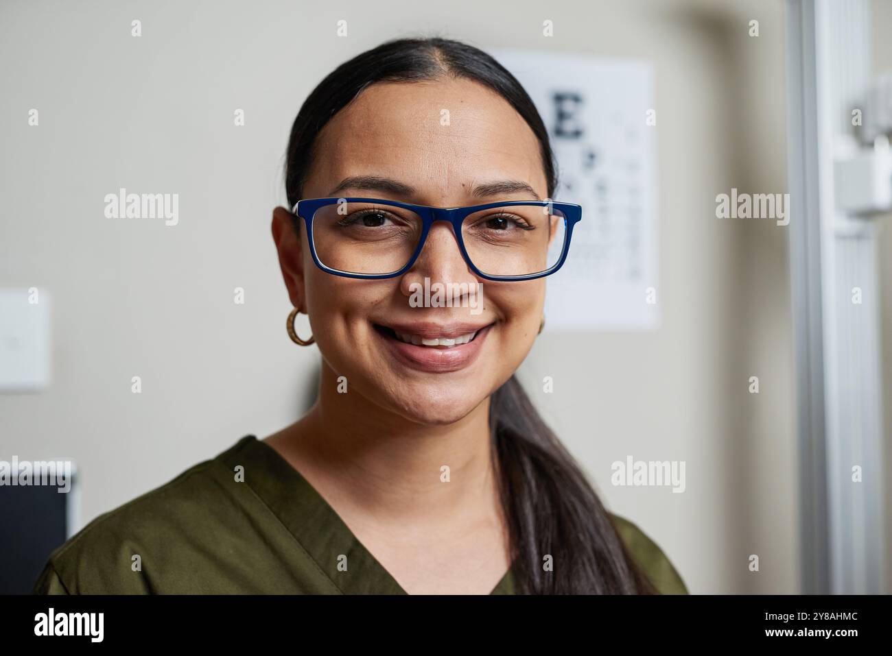 Professional Optometrist Smiling Confidently in Eyeglasses at Modern ...