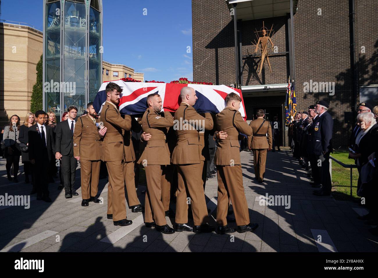 The coffin of 104-year-old D-Day veteran Don Sheppard is carried into ...