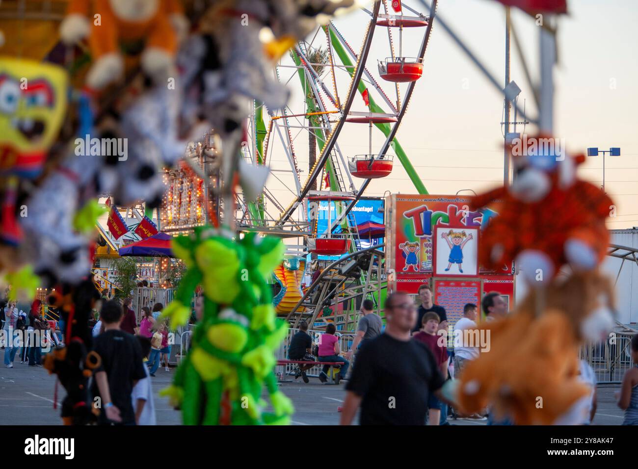 Congested scene from county fair grounds games and rides Stock Photo ...