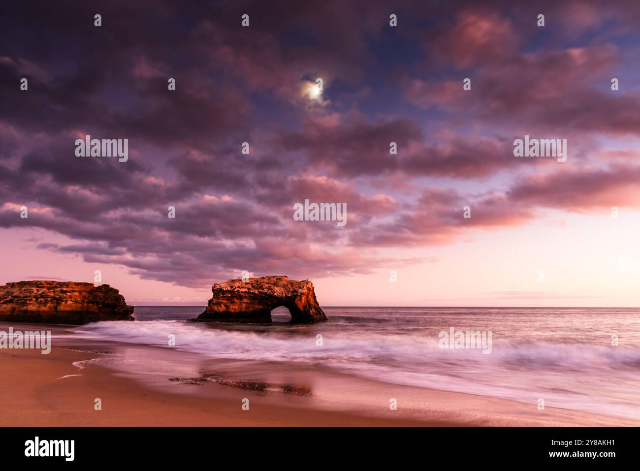 Natural Bridges at sunset with dramatic clouds and waves Stock Photo ...