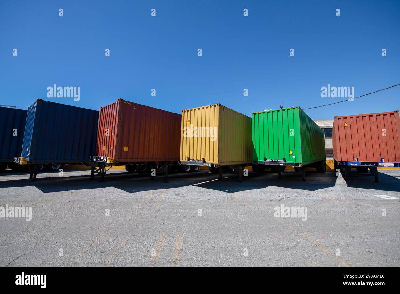 multi colored shipping containers parked on trailers Port of LA Stock ...