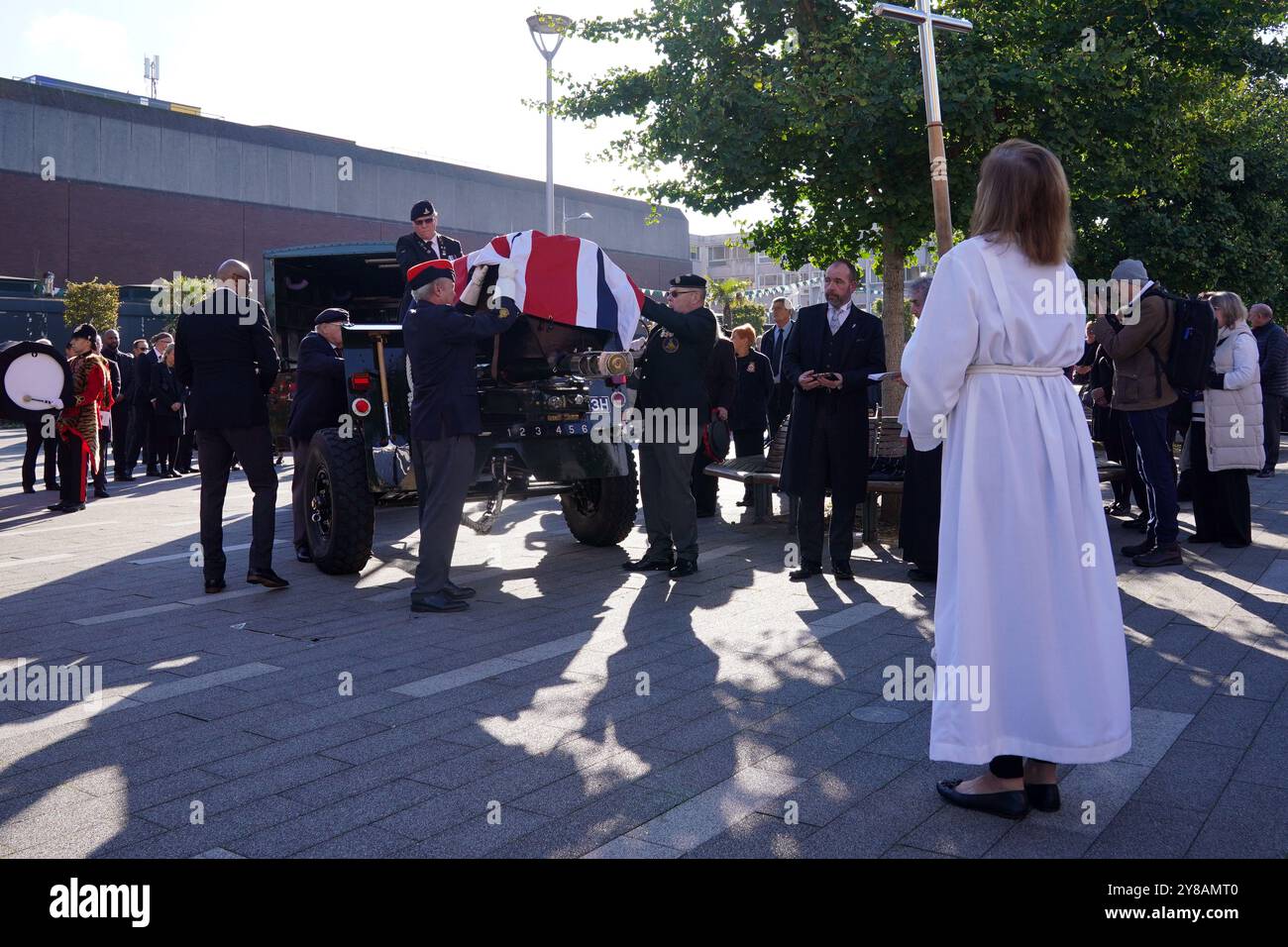 The coffin of 104-year-old D-Day veteran Don Sheppard is lifted off a ...