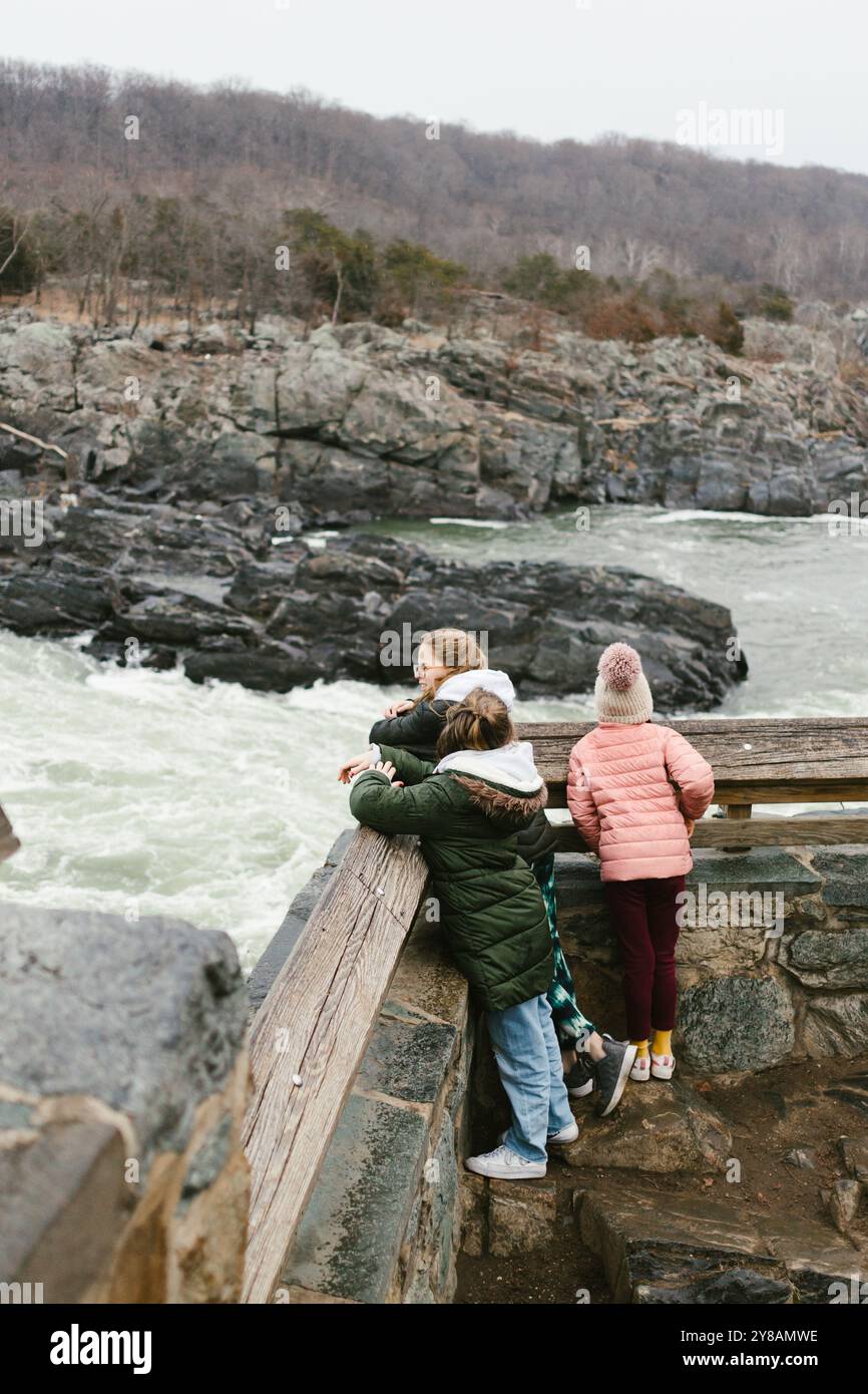 Tween girl cousins overlooking a river going through a canyon Stock ...