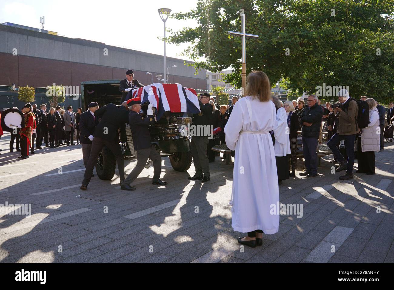 The coffin of 104-year-old D-Day veteran Don Sheppard is lifted off a ...