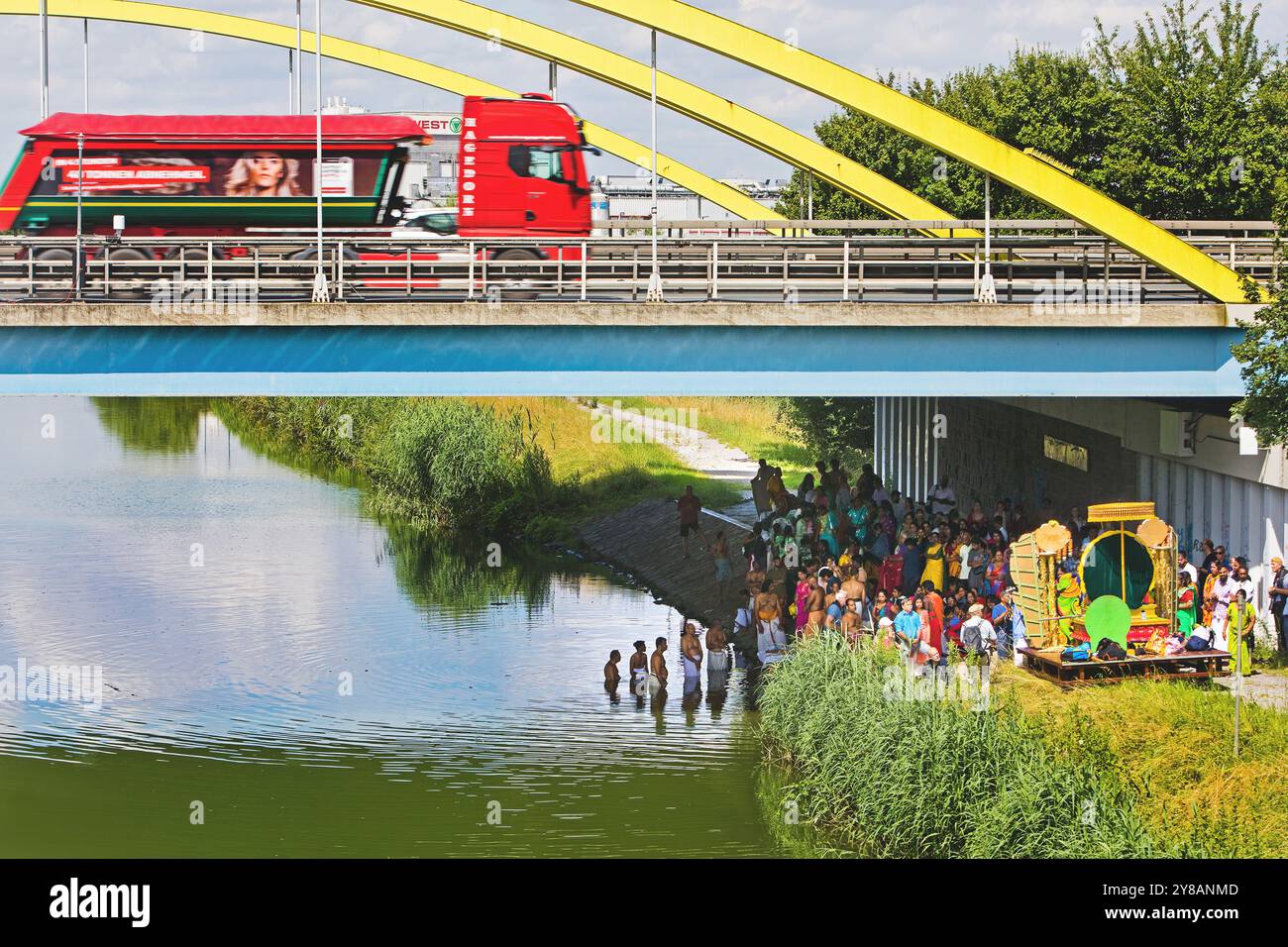 Traffic on the A 2 highway with Hindus under the highway bridge at and ...