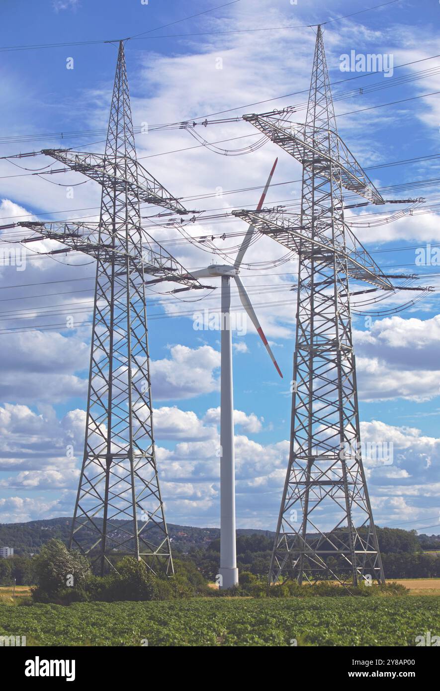 Two overhead line pylons and a wind turbine in Witten, Germany, North ...