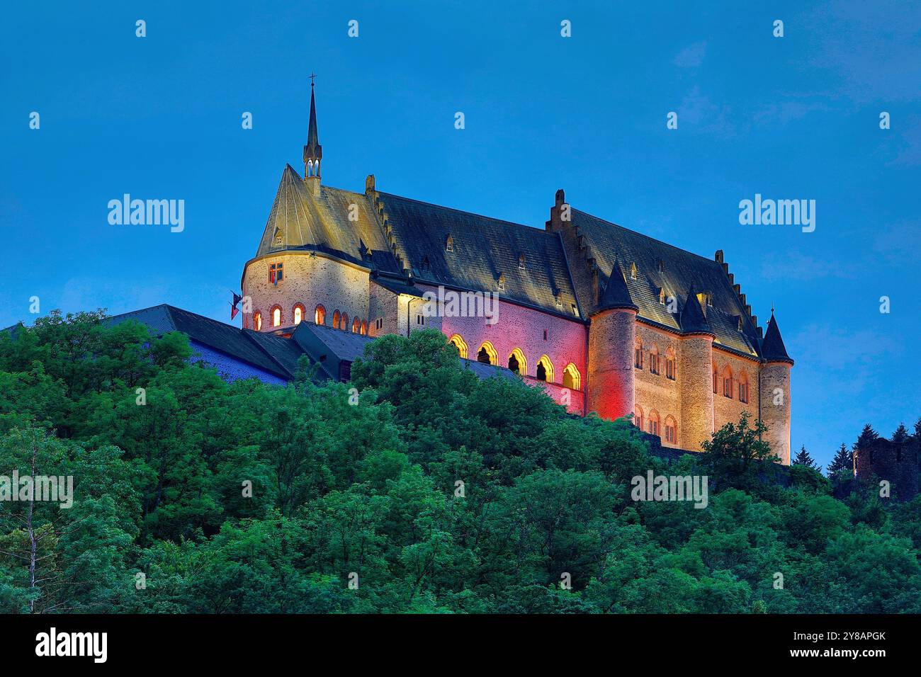 Vianden Castle, illuminated in the colors of the Luxembourg flag for ...