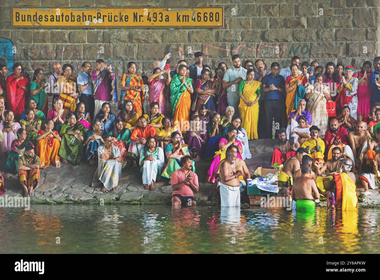 Hindus under the highway bridge of A2 at and in the Datteln-Hamm Canal ...