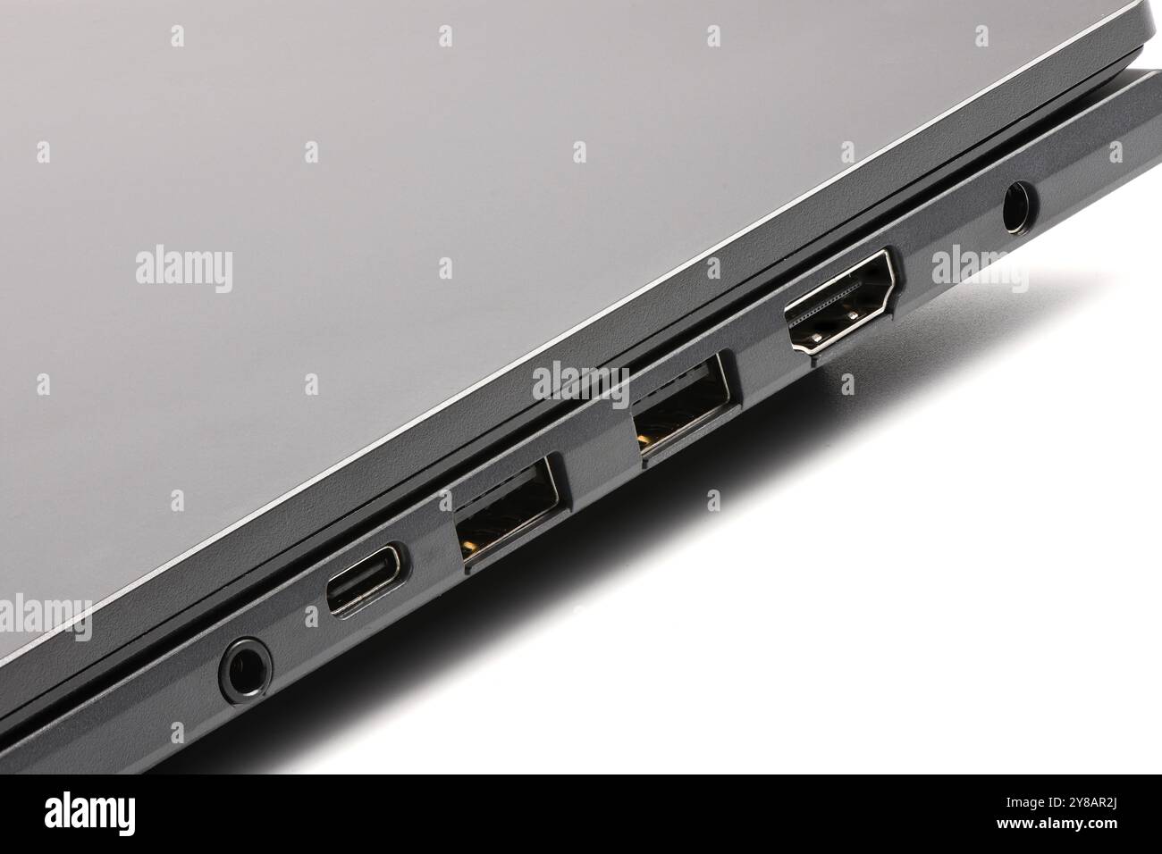 Detailed side view of modern laptop with Power ports, HDMI, USB and ...