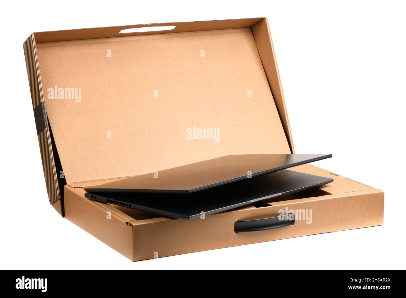 New laptop out of its cardboard box. Carton packaging of laptop with ...