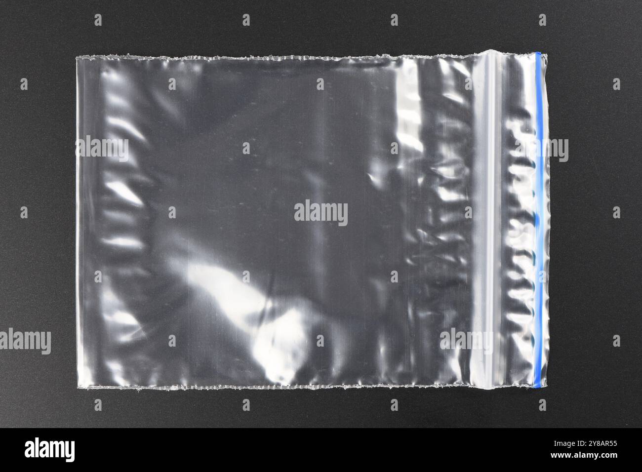 Polyethylene zip bag on black background. Blank transparent plastic bag ...