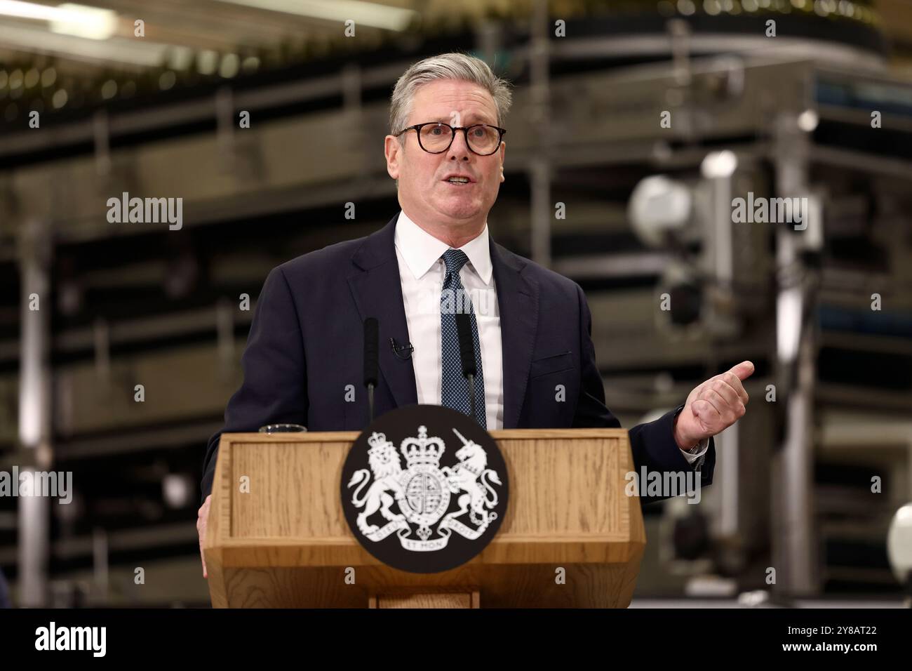 Britain's Prime Minister Keir Starmer speaks to employees during a ...