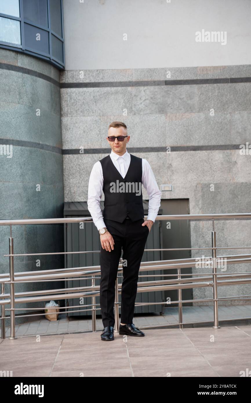 Elegant Man in Formal Attire with Sunglasses Posing Outdoors Stock ...