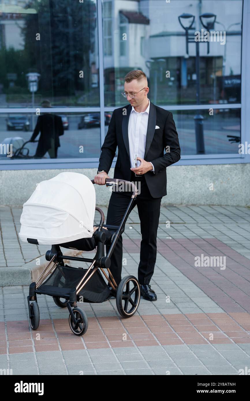 Elegant Father Strolling with Modern Baby Stroller in Urban Setting ...